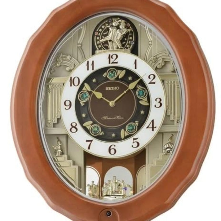 Seiko Wall Clock Elegant Brown Oval Wooden Hourly Chime 30 Melody QXM6 ...